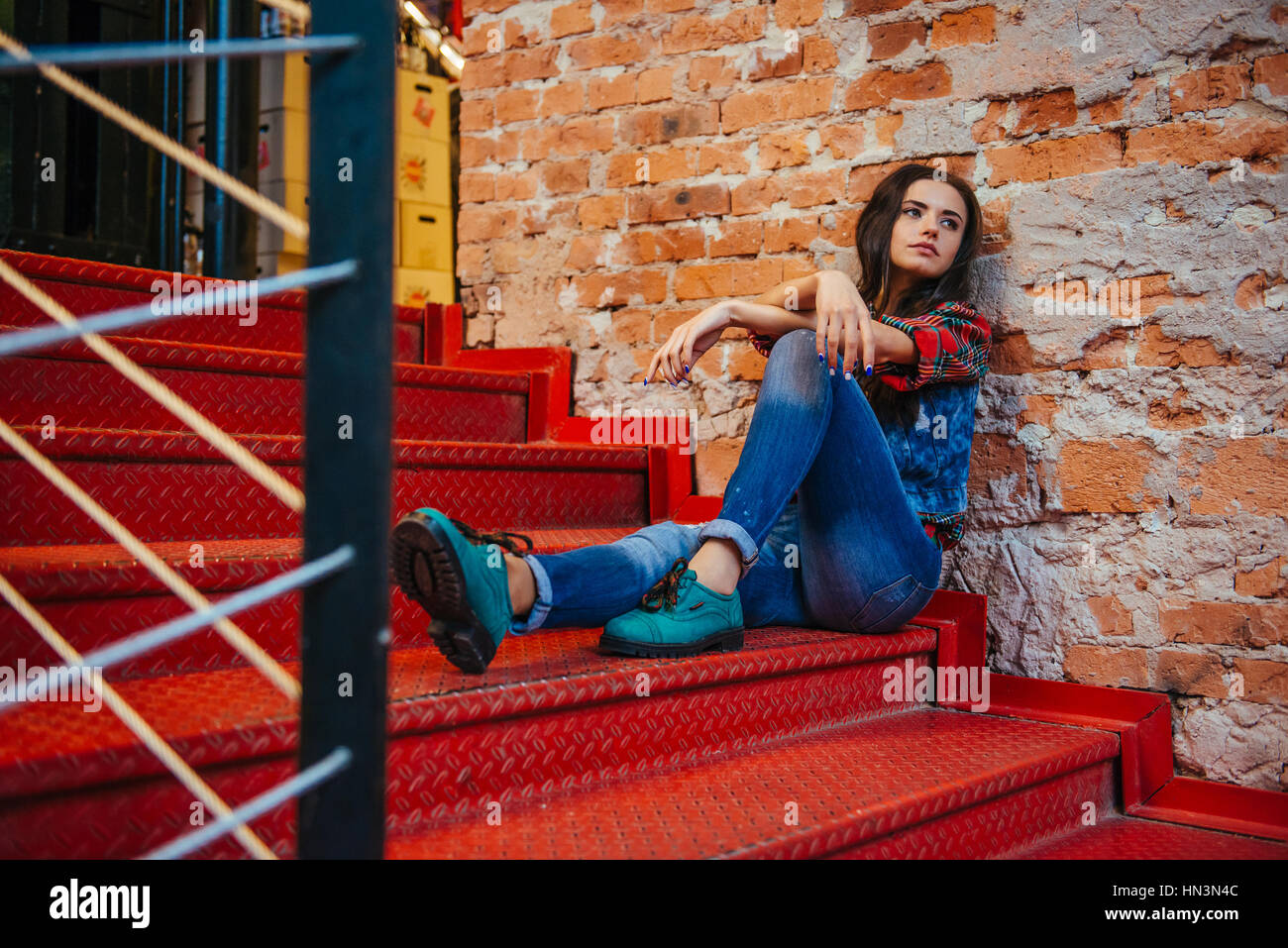 girl sitting on the stairs Stock Photo - Alamy