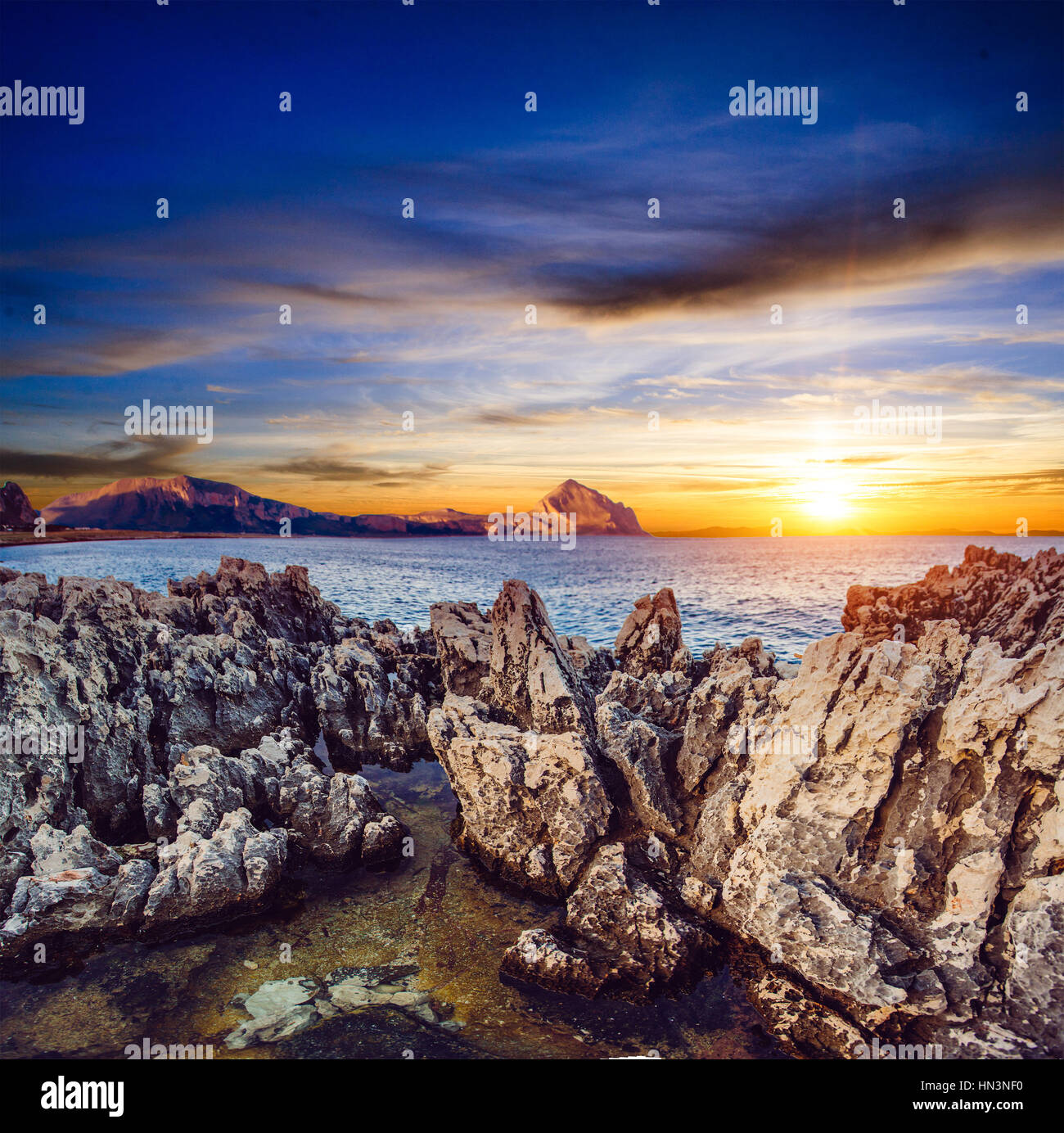 Sunset over the rocks Stock Photo - Alamy