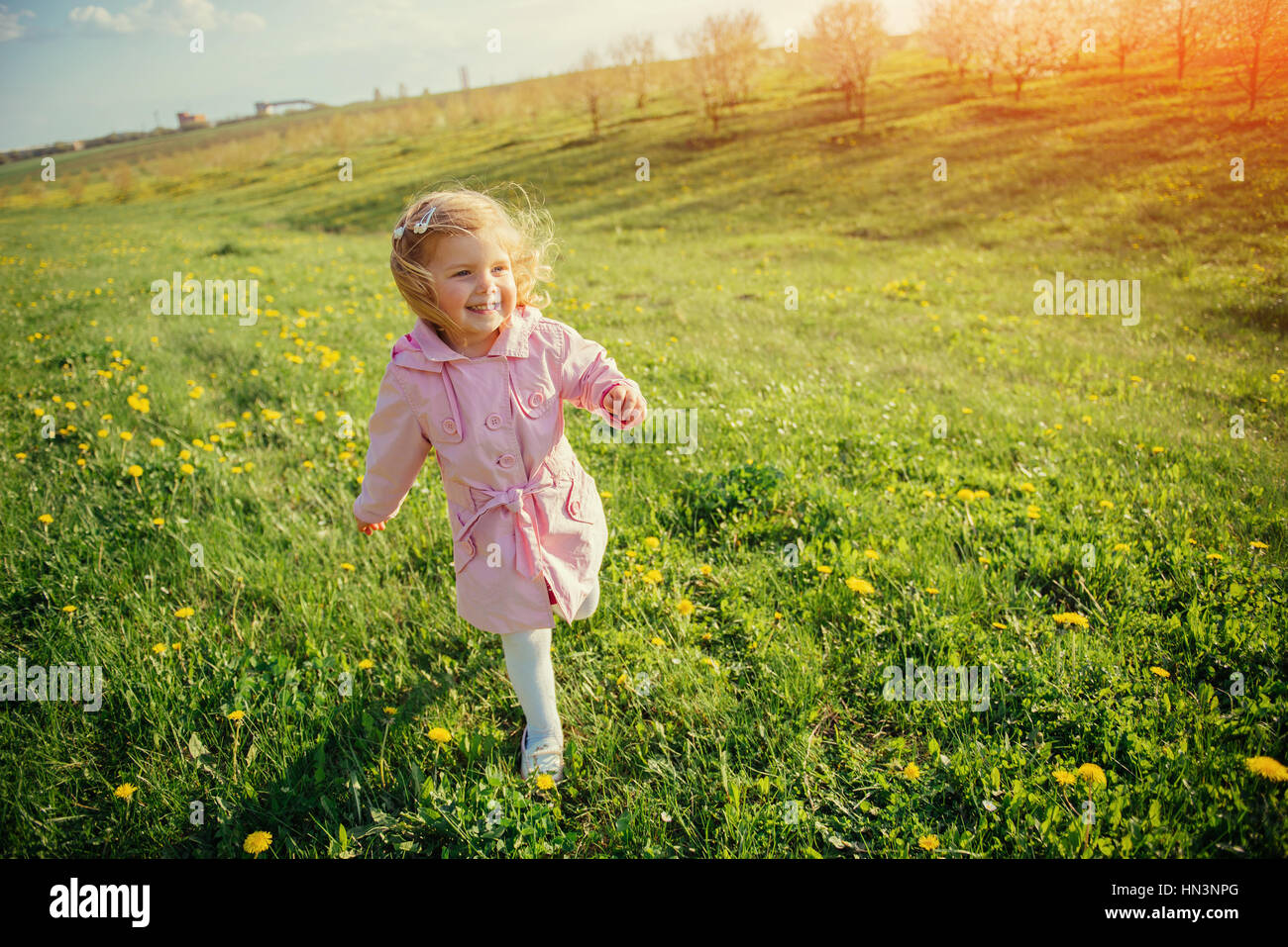 The little girl that runs in spring sunny day. Art processing an Stock ...