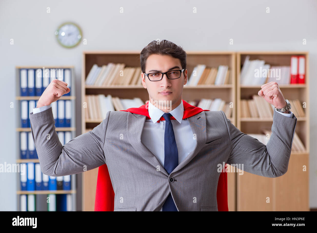 Superhero businessman working in the office Stock Photo - Alamy