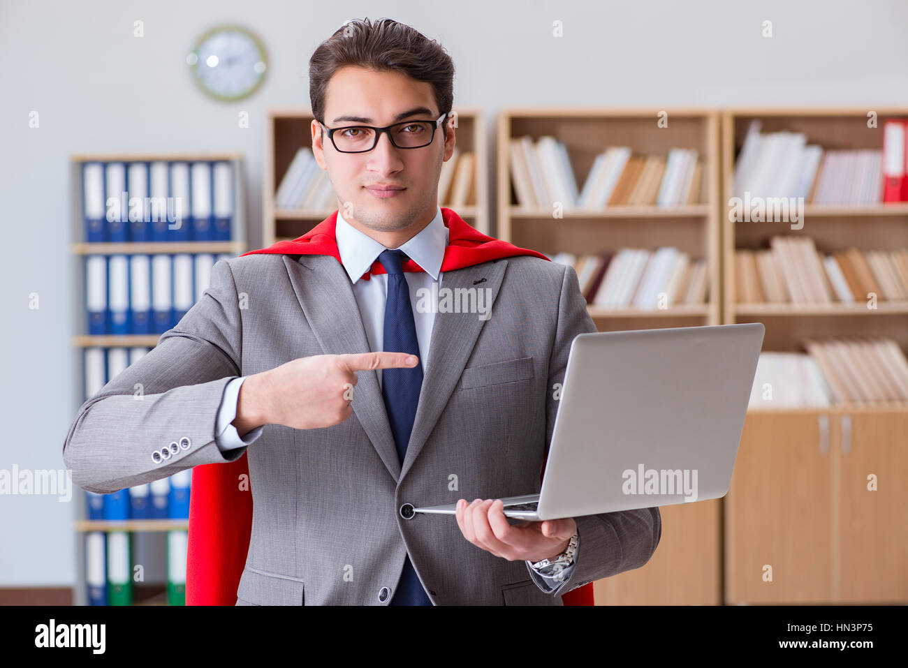 Superhero businessman working in the office Stock Photo - Alamy