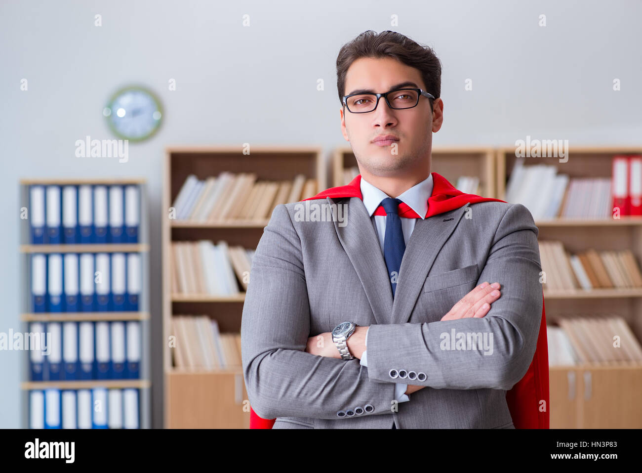 Superhero businessman working in the office Stock Photo - Alamy