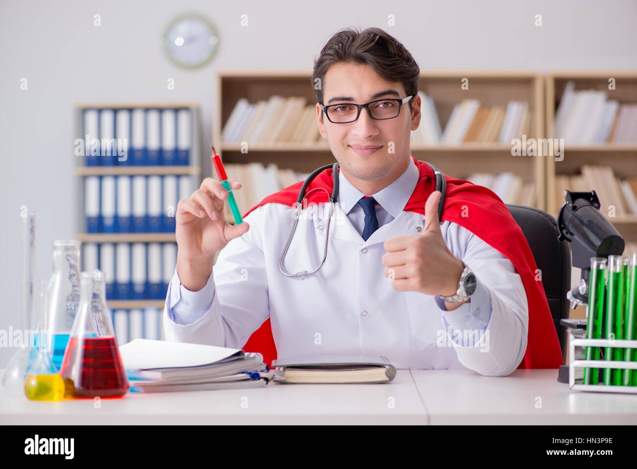 Superhero doctor working in the lab hospital Stock Photo - Alamy