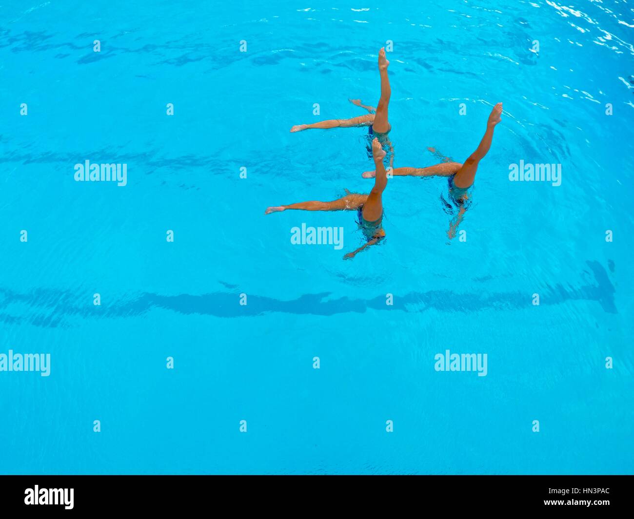 Teenage girls practice synchronized swimming Stock Photo - Alamy