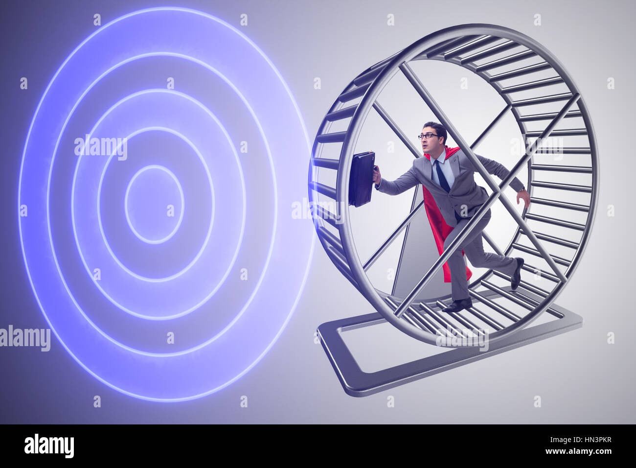 Businessman running on hamster wheel Stock Photo - Alamy
