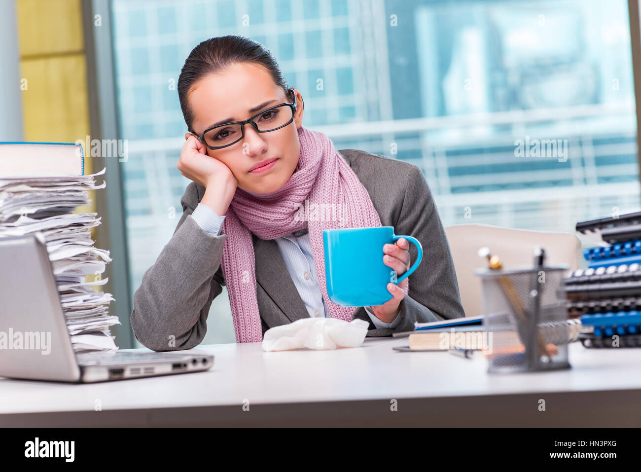 Young businesswoman sick in the office Stock Photo - Alamy