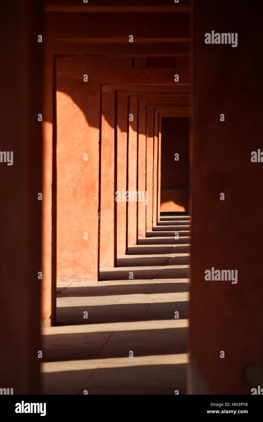 Sandstone corridor with sunlight and shadows Stock Photo - Alamy