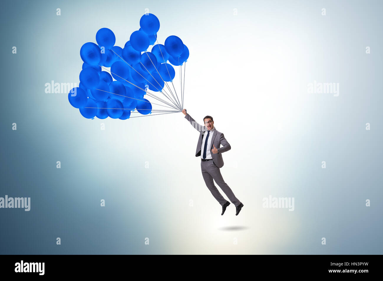 Businessman flying on balloon in challenge concept Stock Photo - Alamy