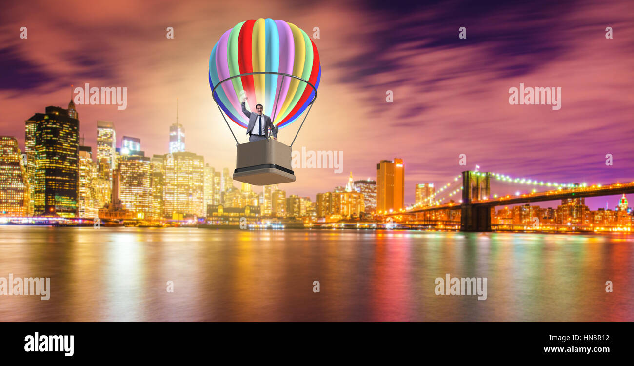 Businessman flying on balloon in challenge concept Stock Photo - Alamy