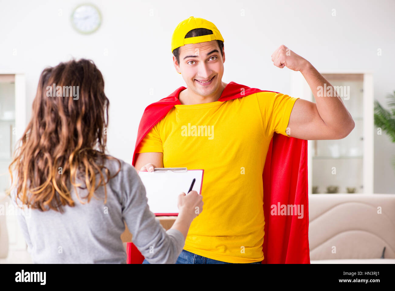 Superhero delivery guy with box Stock Photo - Alamy
