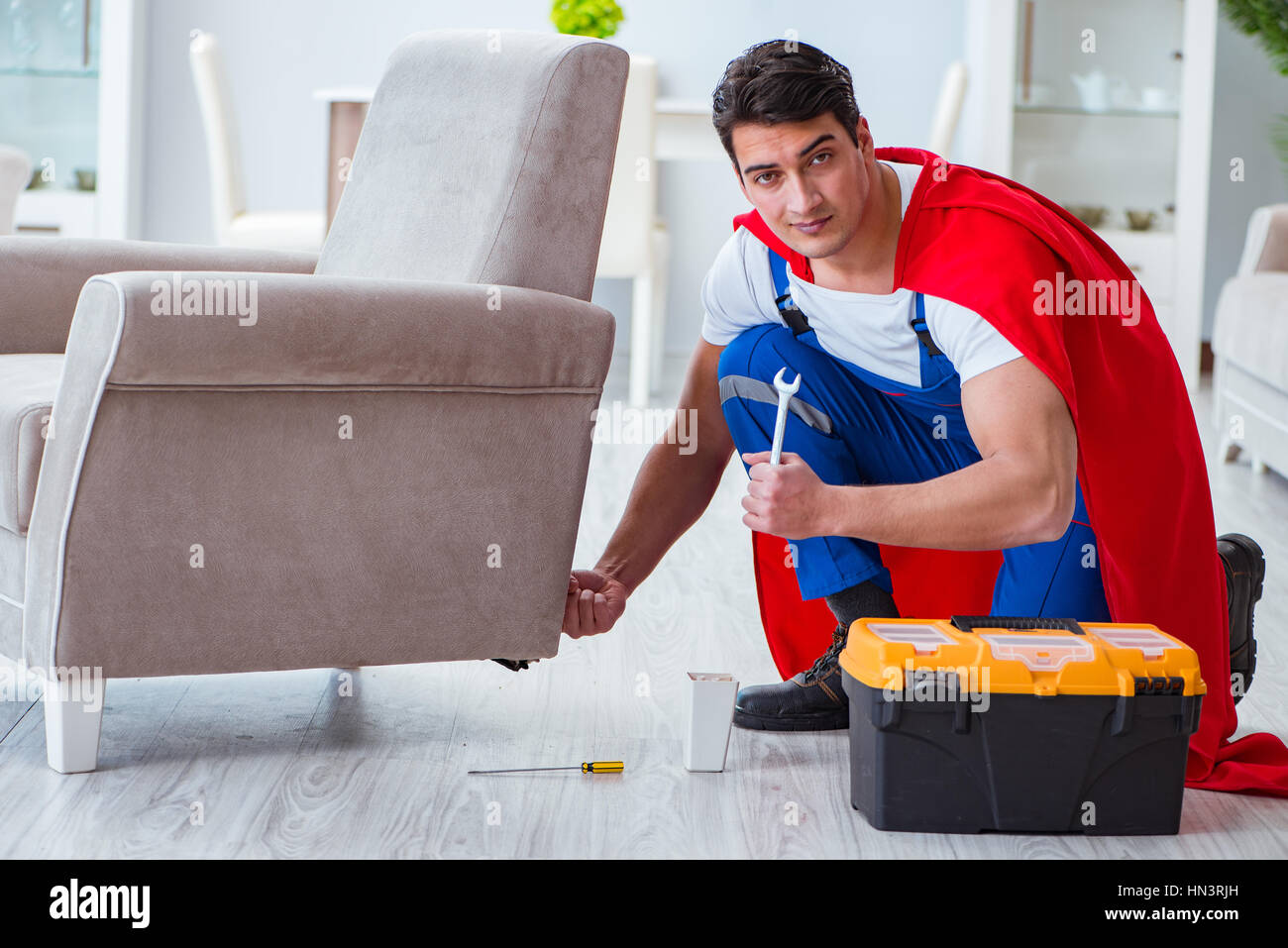Super hero repairman working at home Stock Photo - Alamy