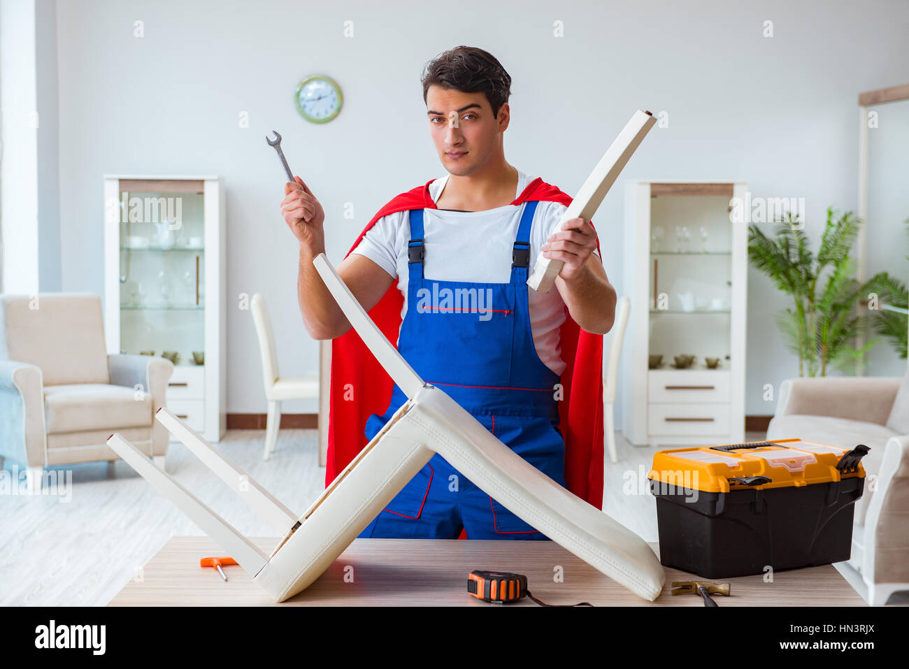 Super hero repairman working at home Stock Photo - Alamy