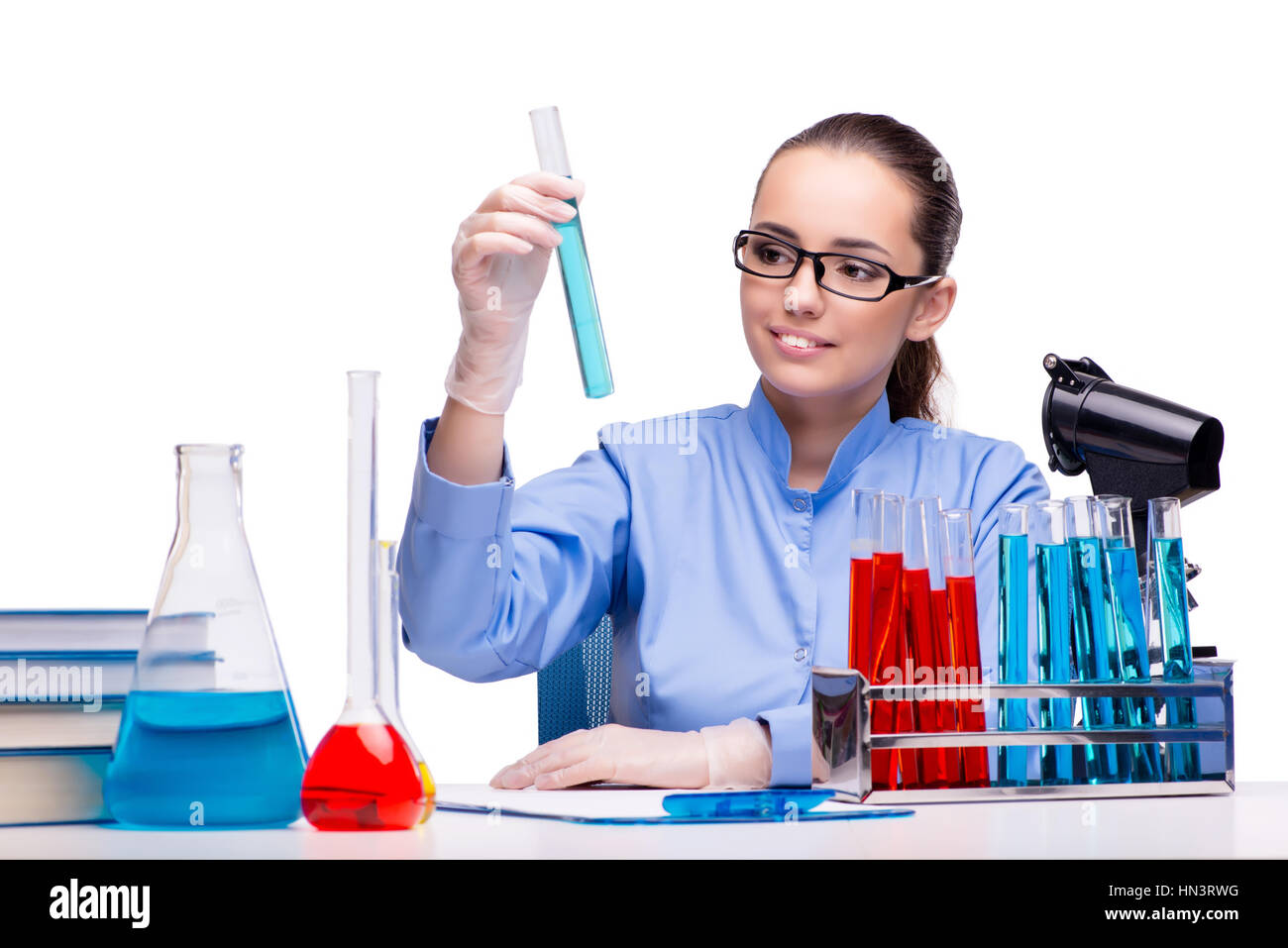 Lab chemist working with microscope and tubes Stock Photo - Alamy