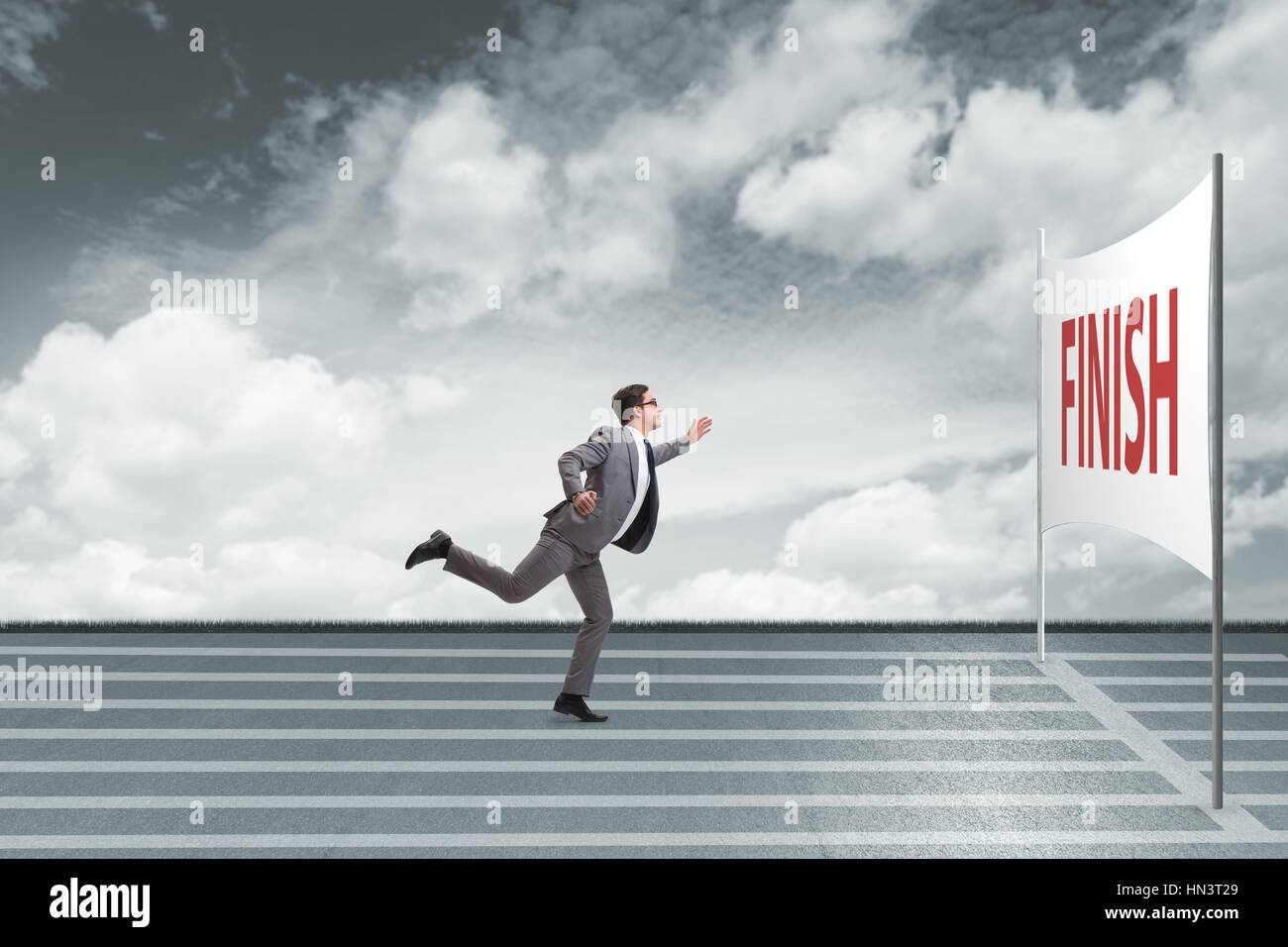 Businessman on the finishing line in competition concept Stock Photo ...