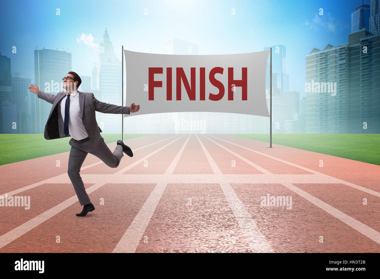 Businessman on the finishing line in competition concept Stock Photo ...