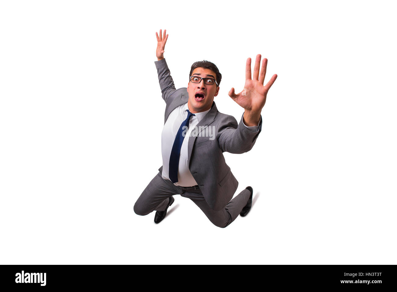Falling businessman isolated on the white background Stock Photo - Alamy