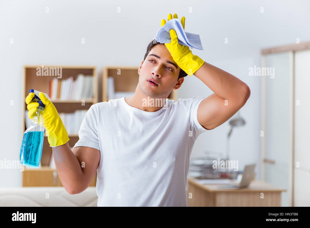 Man husband cleaning the house helping wife Stock Photo - Alamy