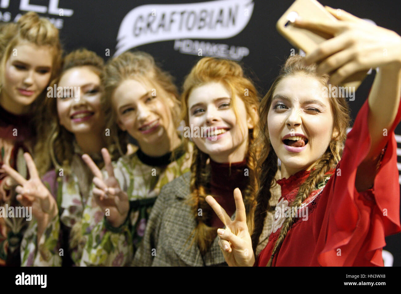 Kiev, Ukraine. 7th Feb, 2017. Models pose for a selfie photo backstage ...