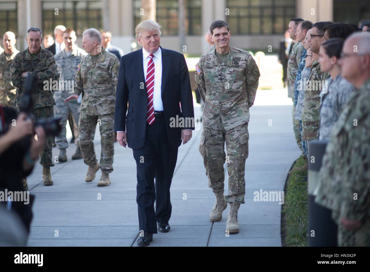 U.S President Donald Trump walks past soldiers escorted by U.S. Army ...