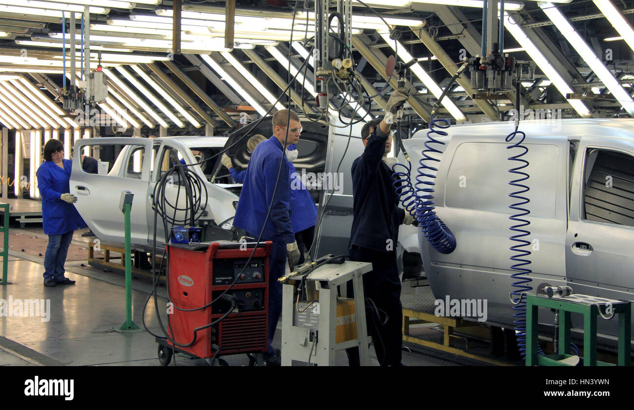 Workers on the Lada production line in the Russian car manufacturer ...