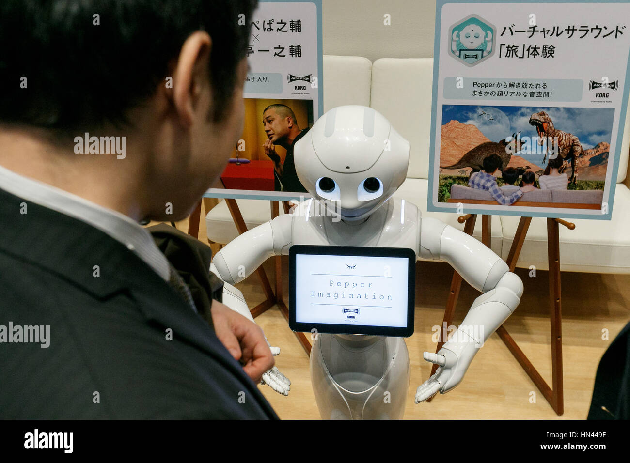 Tokyo, Japan. 8th Feb, 2017. A visitor looks at a SoftBank's humanoid ...