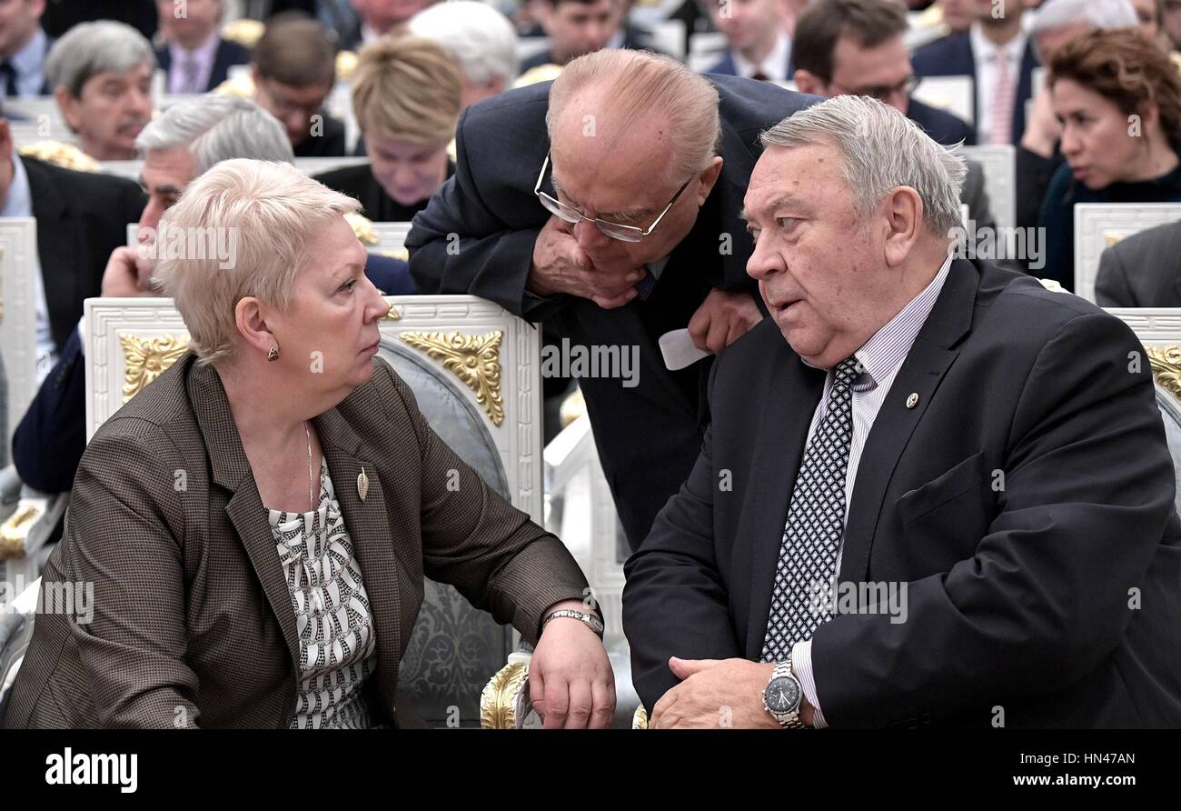 Russian Education and Science Minister Olga Vasilyeva, left, listens to ...