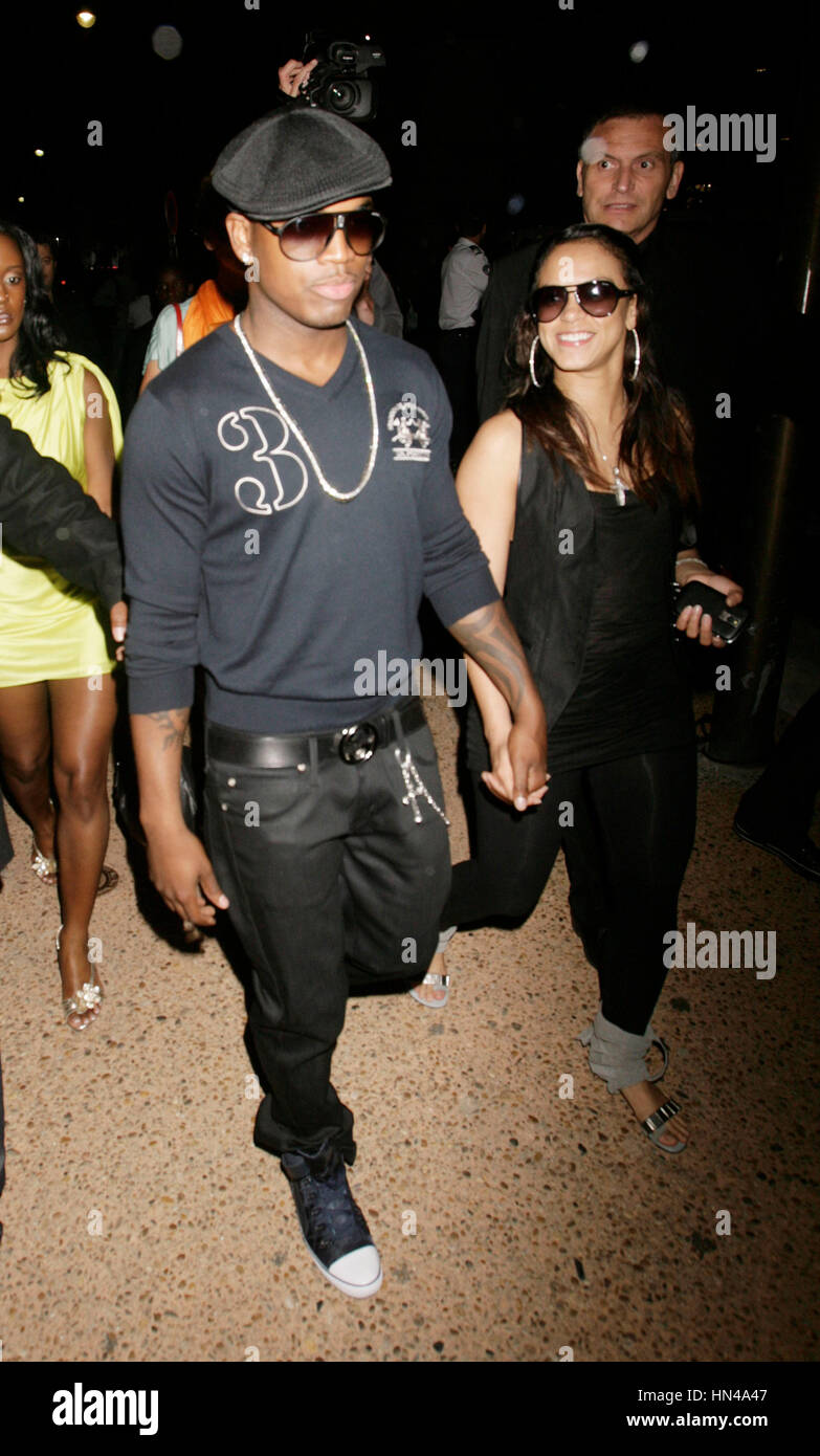 Ne-Yo and girlfriend, Tennille Jimenez, walks down a pier at the 62nd ...