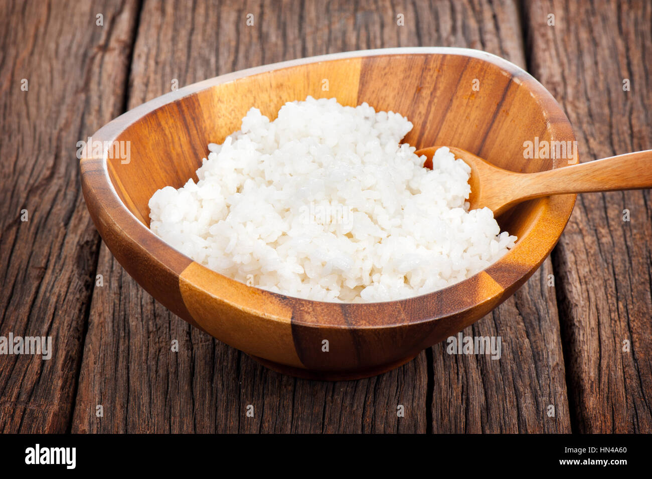Cooked rice on wooden hi-res stock photography and images - Alamy