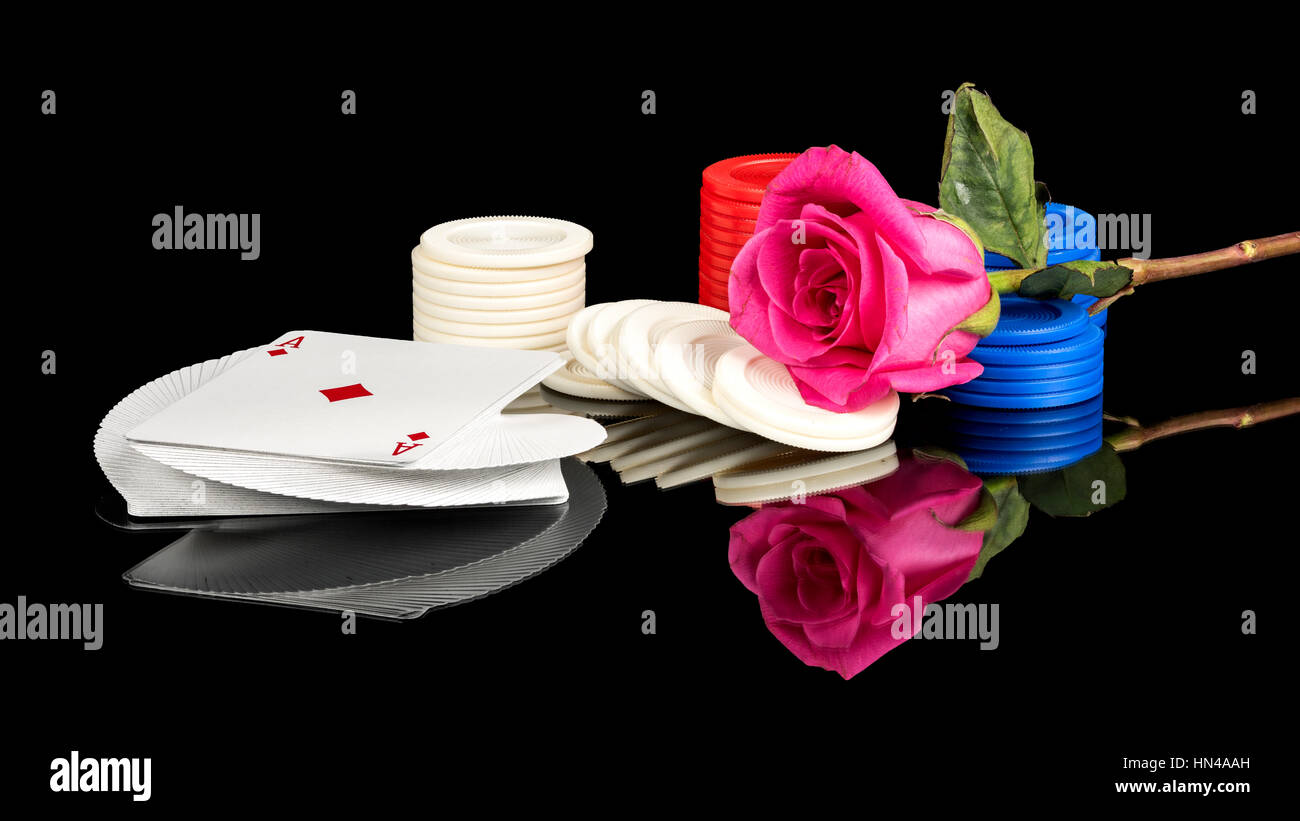 Poker game of cards and chips that includes a natural rose Stock Photo ...
