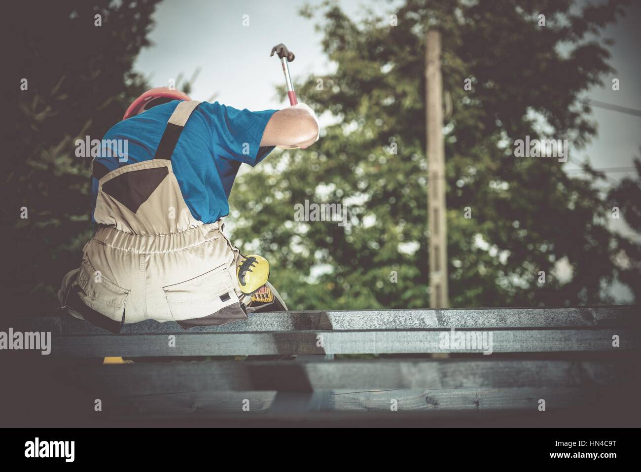 Small Construction Works. Construction Worker on the Wooden Garage ...