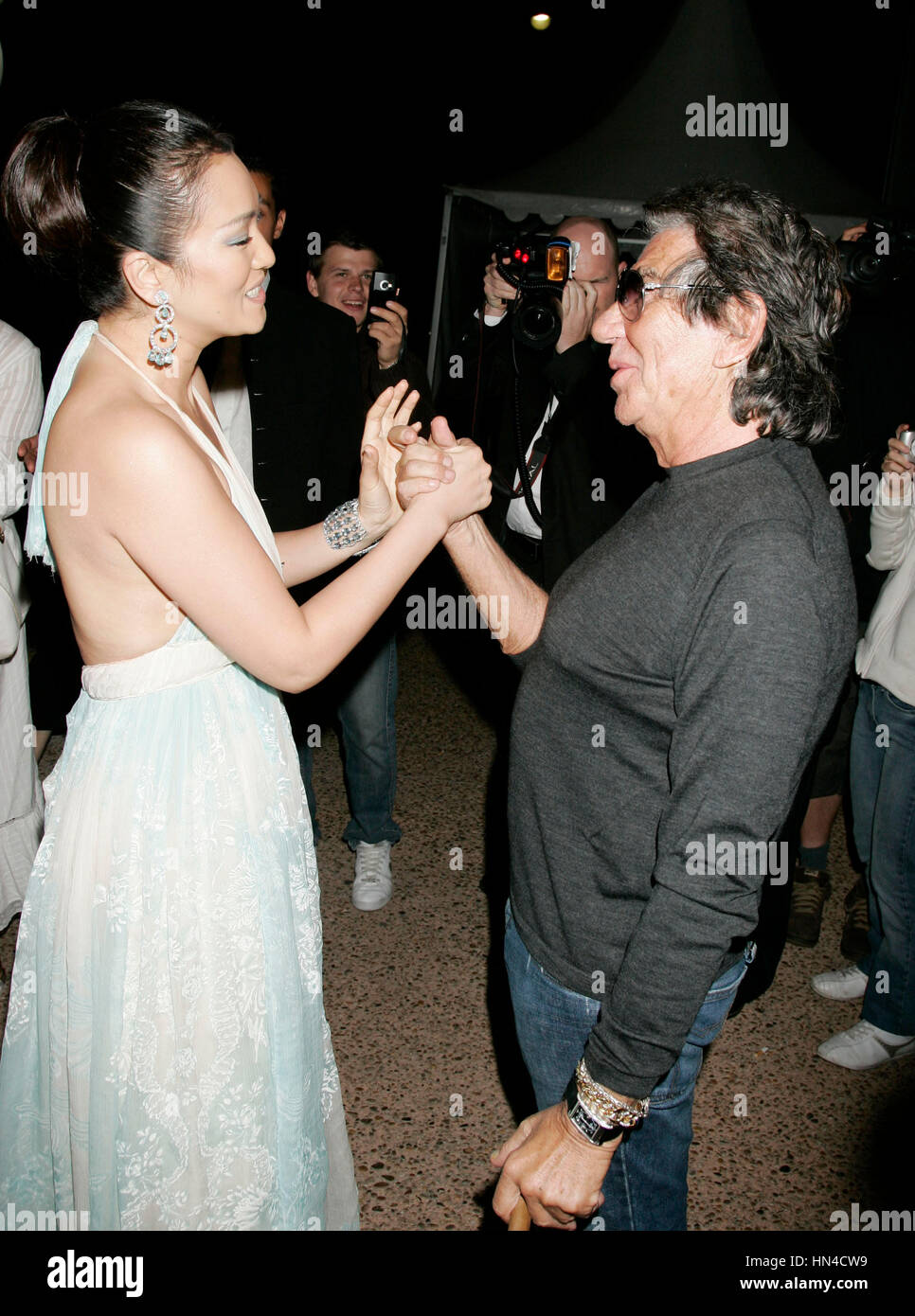 Actress Gong Li With Fashion Designer Robert Cavalli At The Cannes Film
