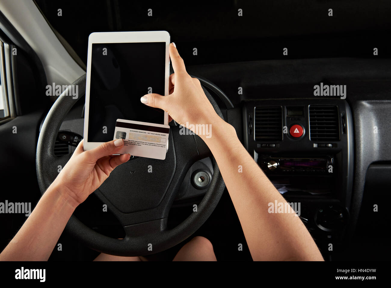 driver buying online using credit card and tablet Stock Photo - Alamy