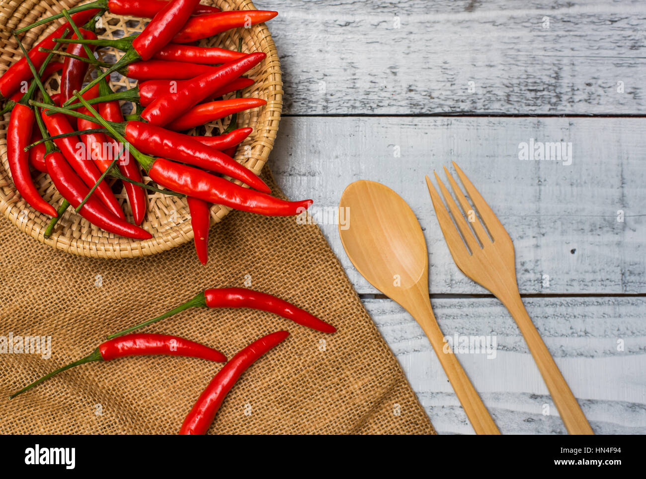 Hot and spicy red chilli on wood table background Stock Photo - Alamy
