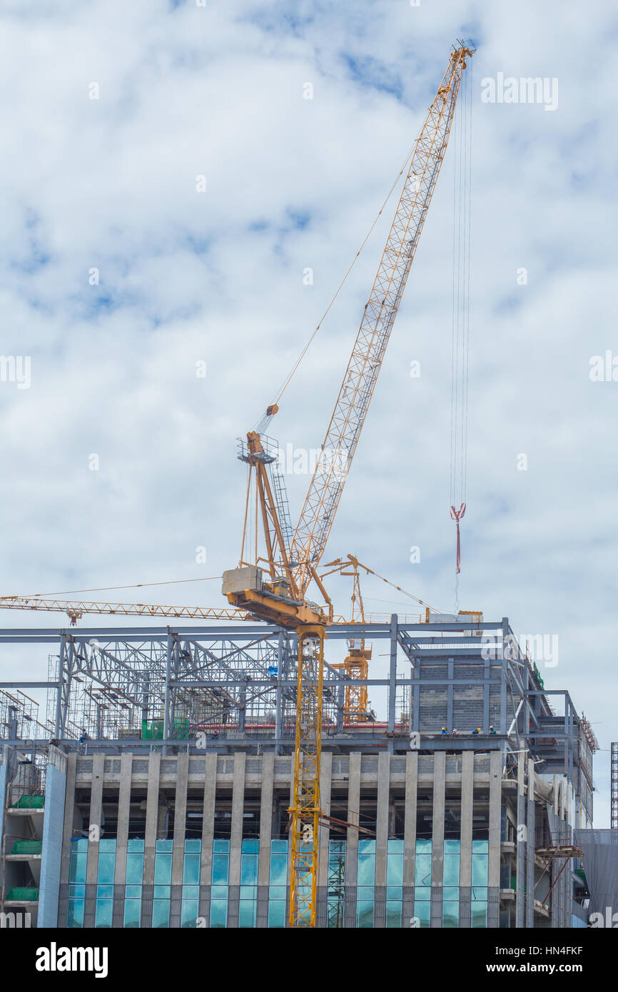 Crane in construction high office building skyscraper with worker ...