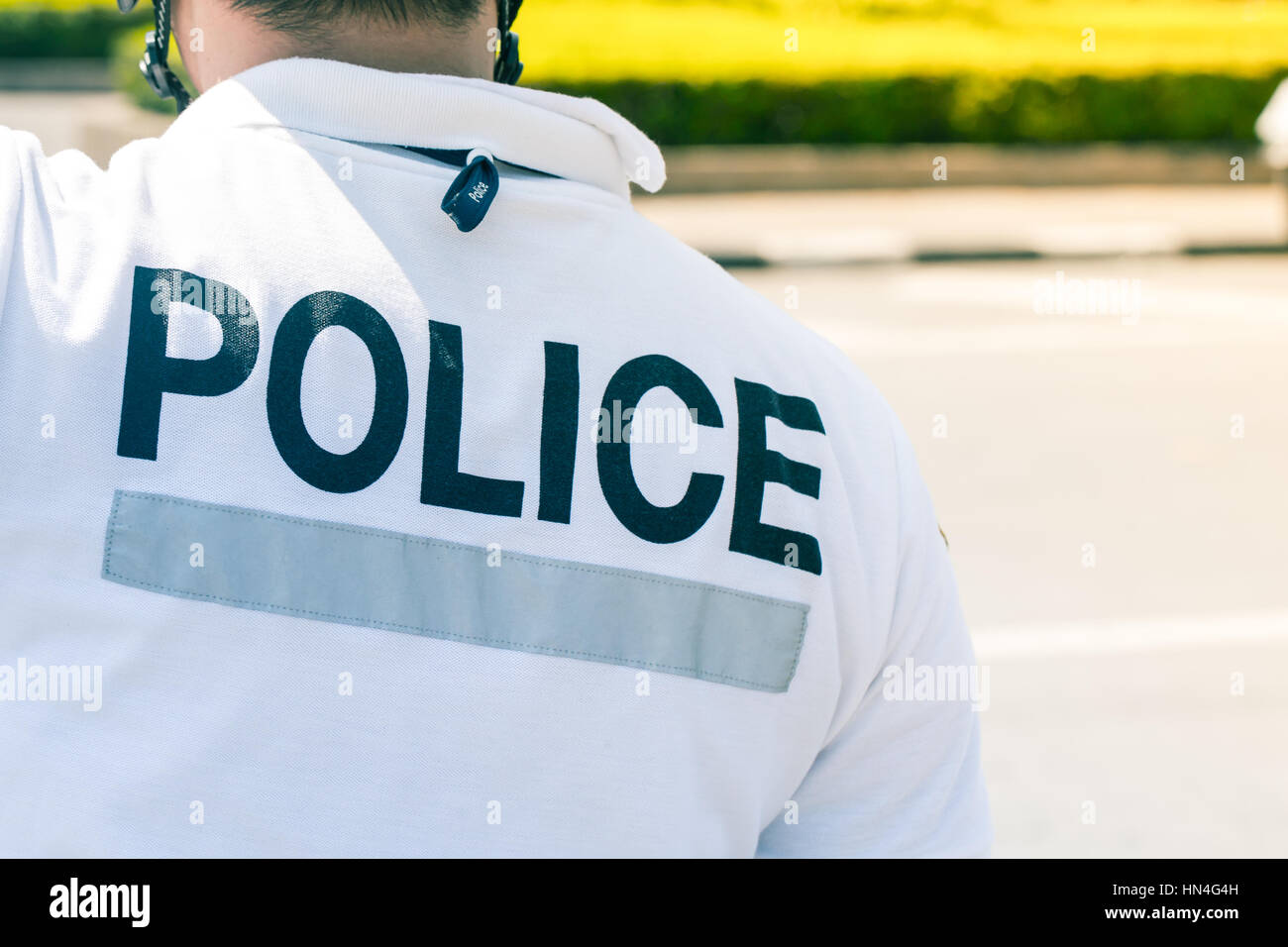 closeup "POLICE" word on back side of Policeman on duty Stock Photo - Alamy