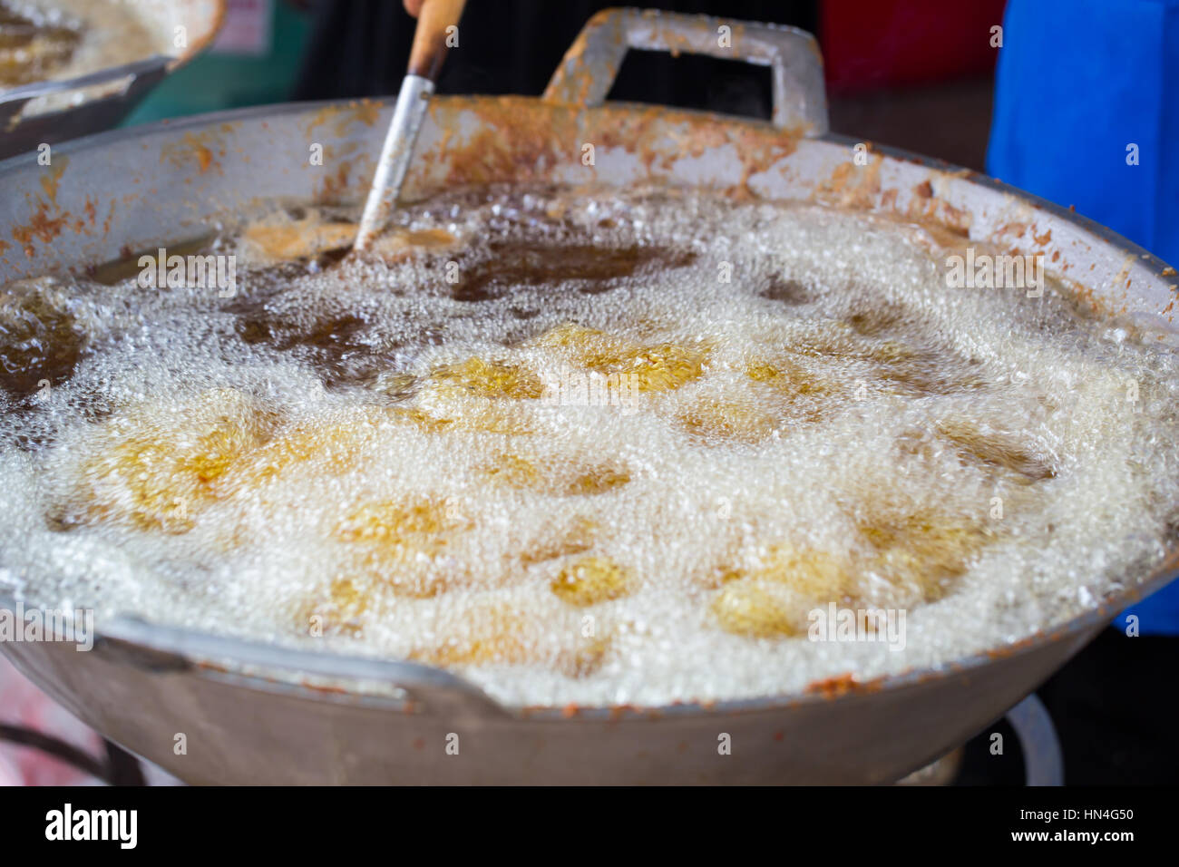 Deep frying, cooking process food is submerged in hot oil Stock Photo ...