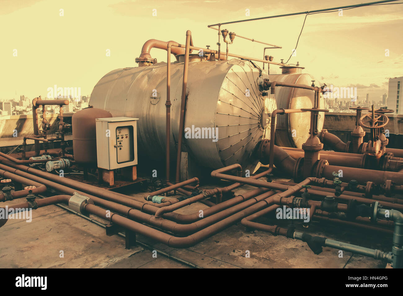 vintage retro industrial machine old grunge rusty pipe and boiler tank ...
