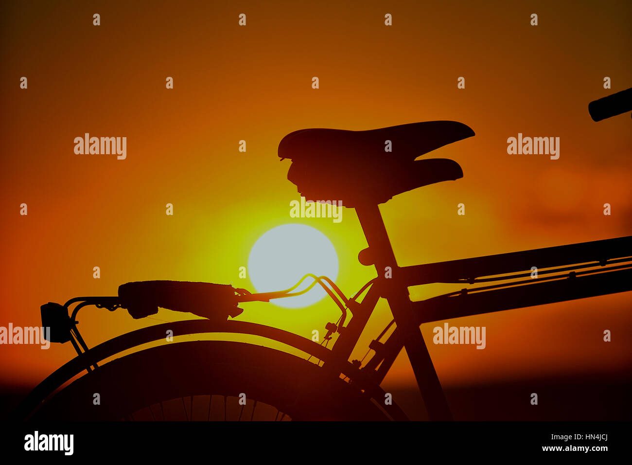 Bicycles on sunset Stock Photo - Alamy