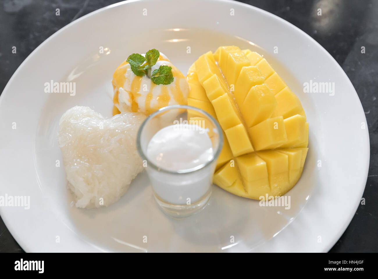 Mango with sticky rice and ice cream Stock Photo - Alamy