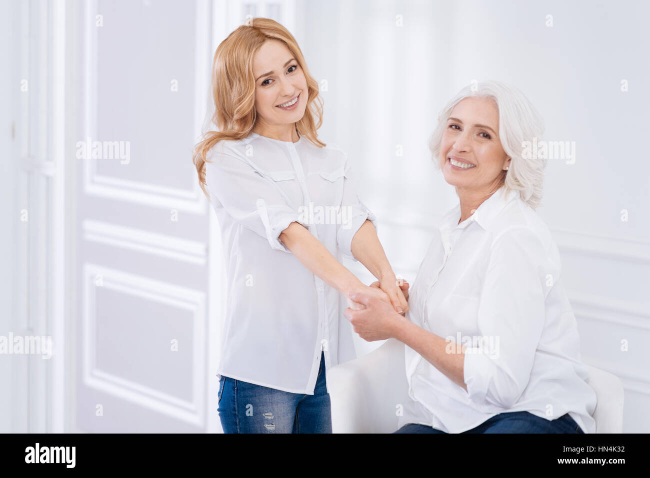 Joyful delighted adult woman resting with her mother Stock Photo - Alamy