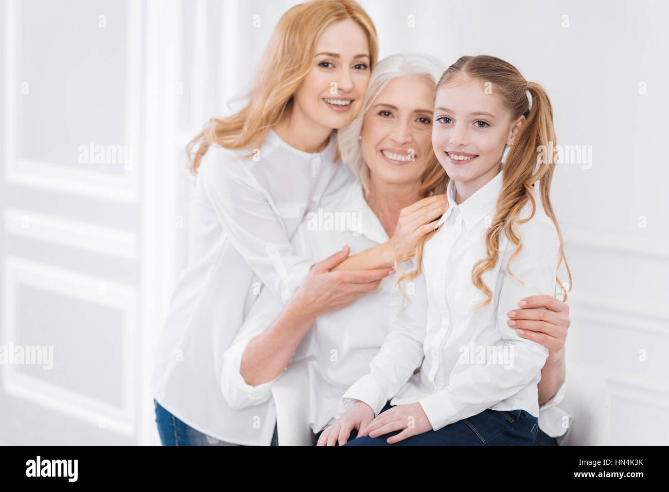 Three generations of the family resting together Stock Photo - Alamy