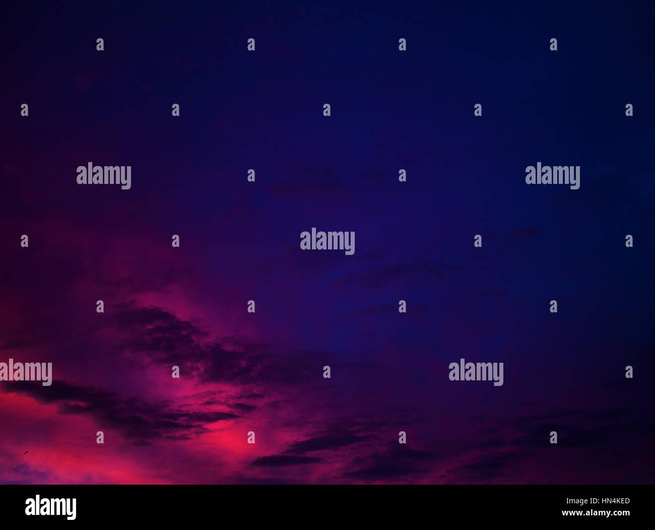 fine red sunset and pack of crows, background Stock Photo - Alamy