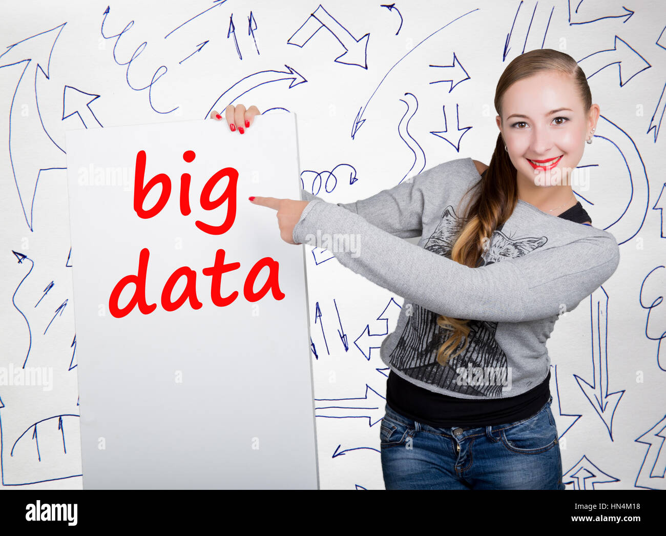 Young woman holding whiteboard with writing word: big data. Technology ...