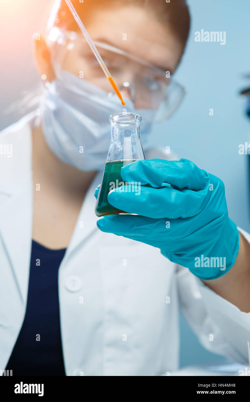 Woman in mask at lab Stock Photo - Alamy