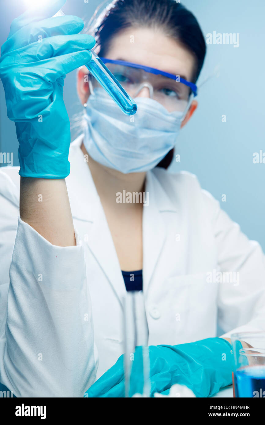 Woman working with test tubes Stock Photo - Alamy