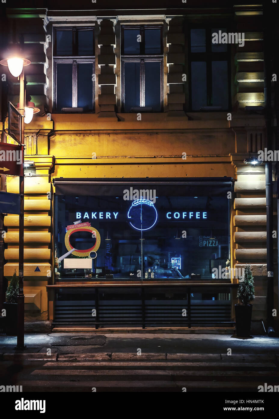 Night scene of a bakery and coffee shop Stock Photo - Alamy
