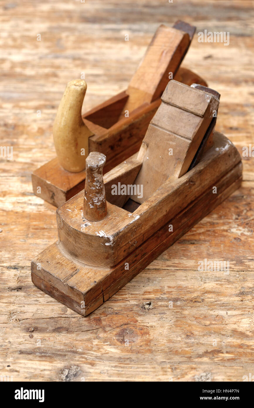 Backgrounds and textures: two old carpenter's planes on a wooden ...