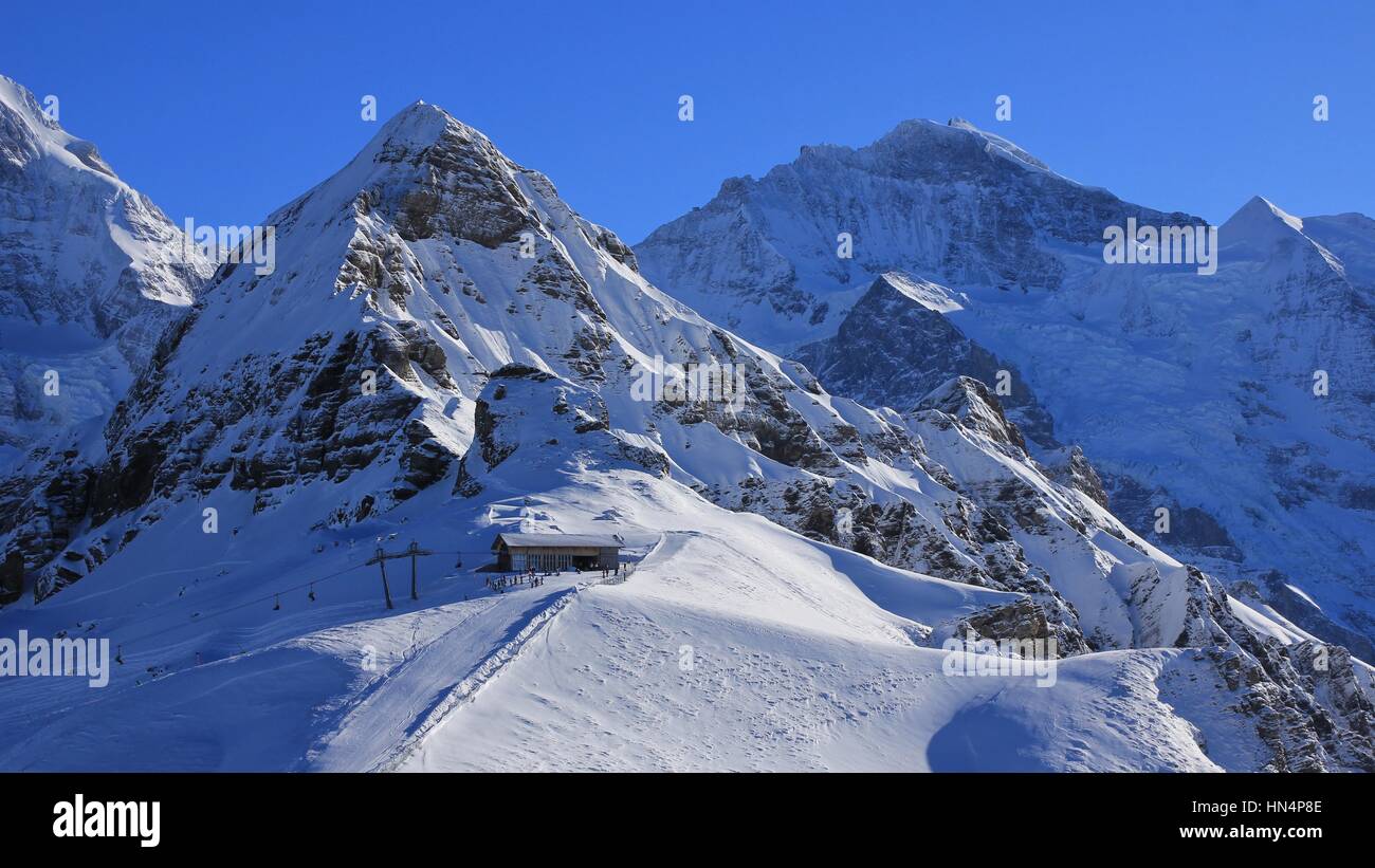 Winter scene in Grindelwald, Swiss Alps. Snow covered mountains ...