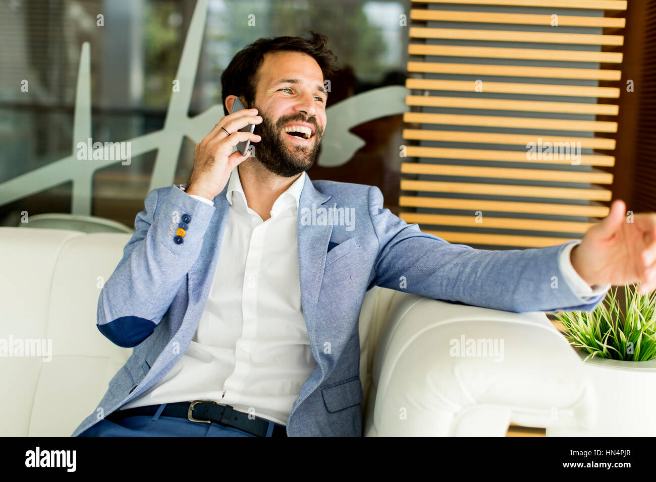 Handsome businessman talking over the mobile phone Stock Photo - Alamy