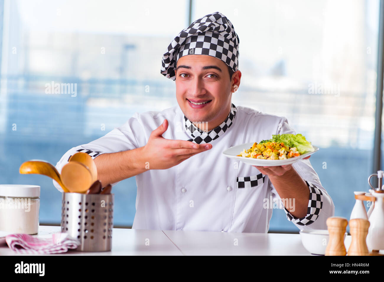 Man preparing food at the kitchen Stock Photo - Alamy